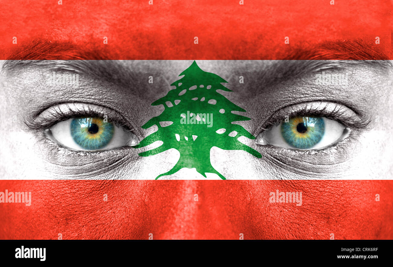 Human face painted with flag of Lebanon Stock Photo - Alamy