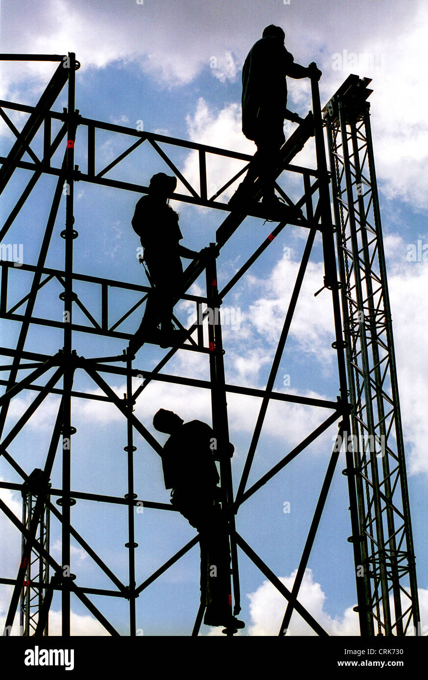 Silhouettes of several men in a scaffold Stock Photo - Alamy