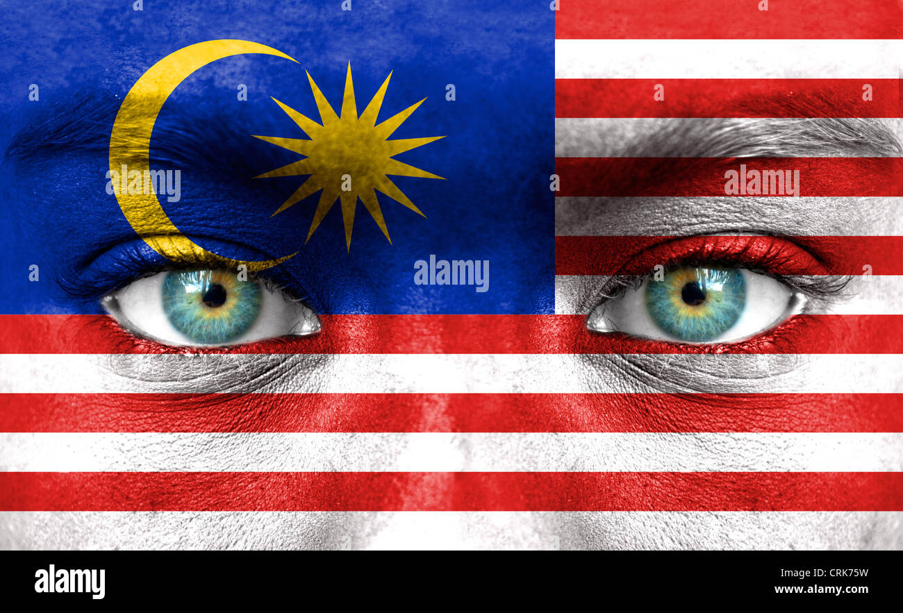 Human face painted with flag of Malaysia Stock Photo - Alamy