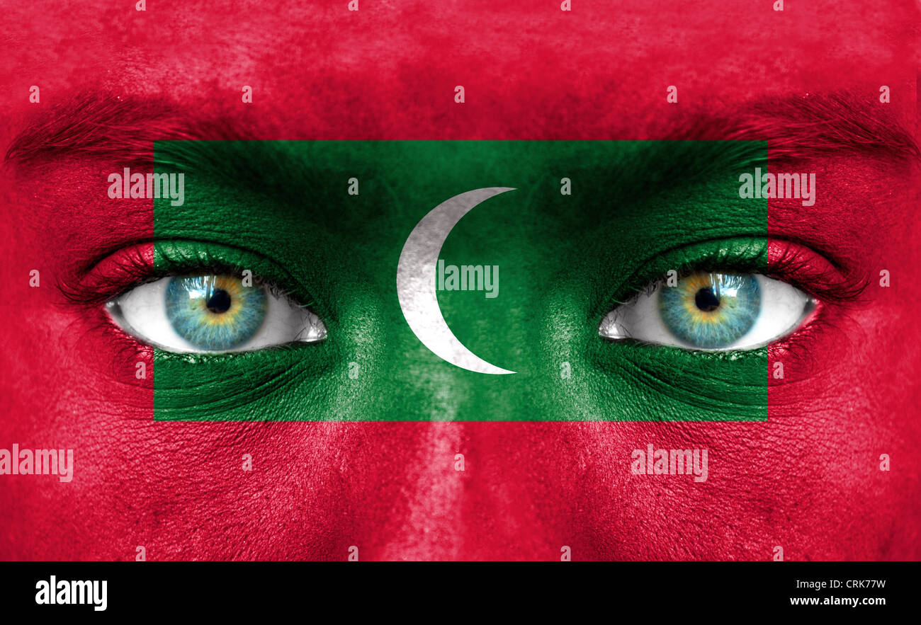 Human face painted with flag of Maldives Stock Photo - Alamy