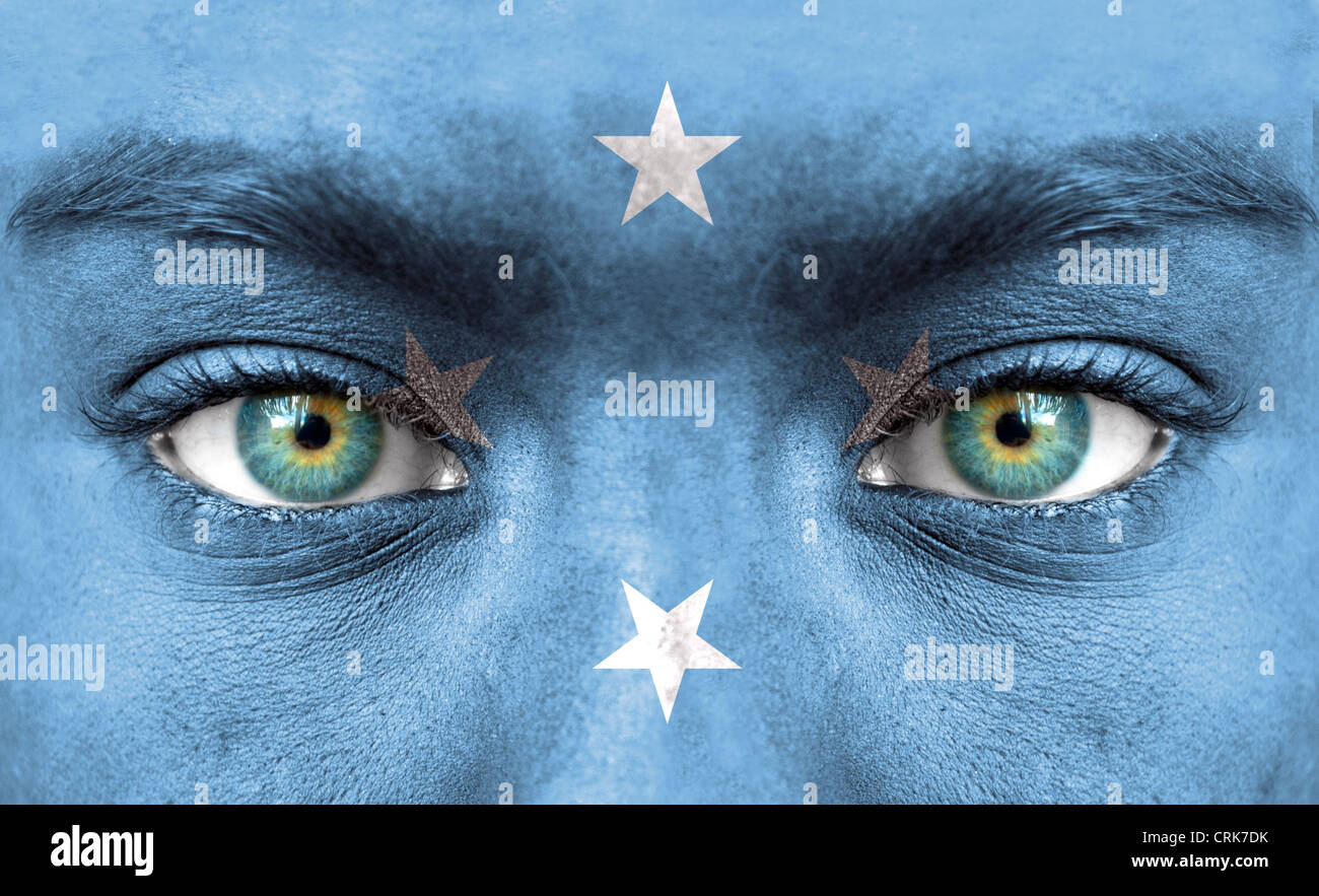 Human face painted with flag of Micronesia Stock Photo - Alamy