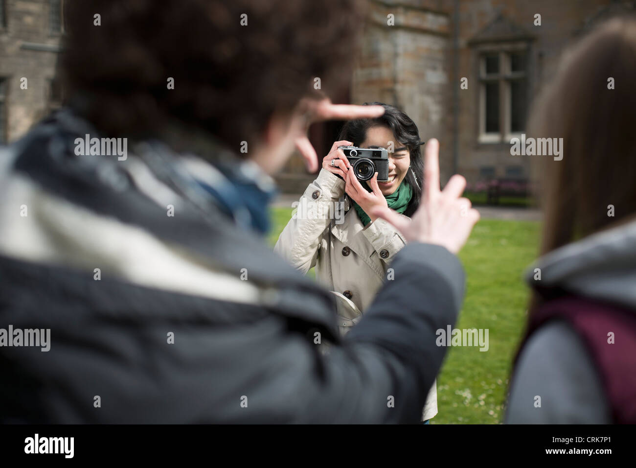 Student taking picture of friends Stock Photo - Alamy