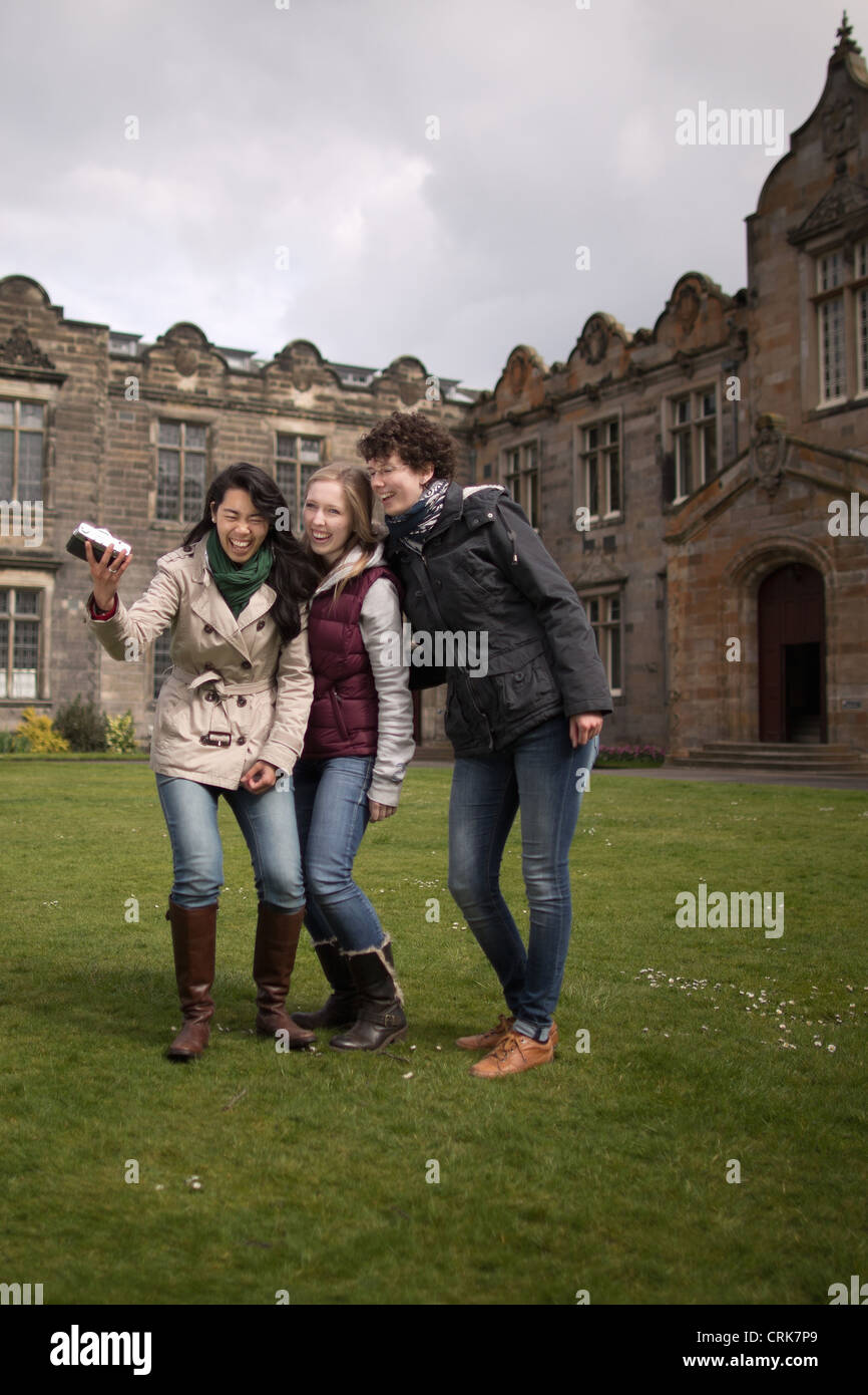 Students laughing together on campus Stock Photo - Alamy