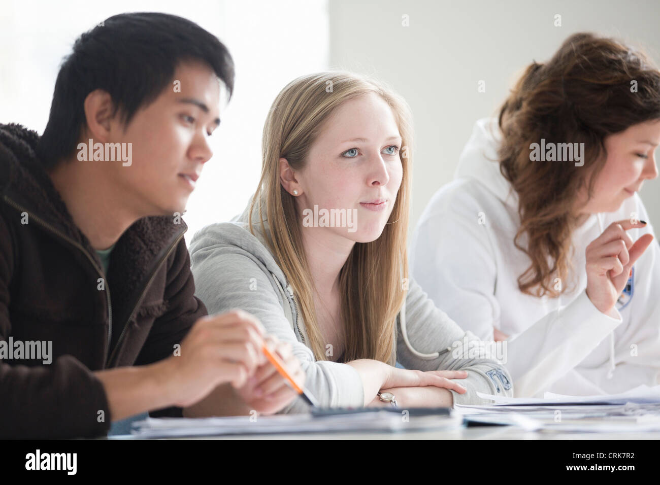 Students sitting at desk in class Stock Photo - Alamy