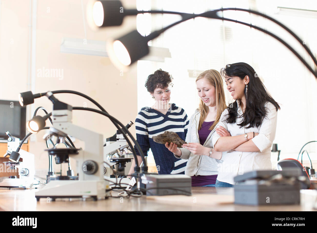 Students working in geology lab Stock Photo - Alamy