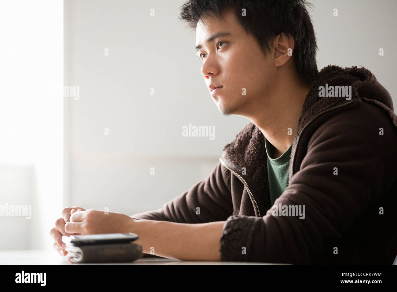 Student sitting at desk in class Stock Photo - Alamy