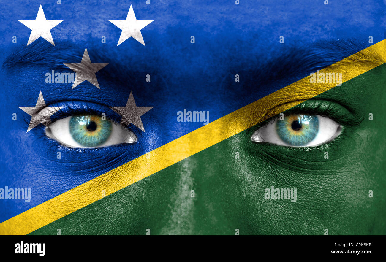 Human face painted with flag of Solomon Islands Stock Photo - Alamy