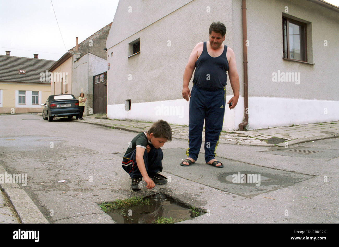 Father with his boy in front of her house Bohemia Stock Photo - Alamy