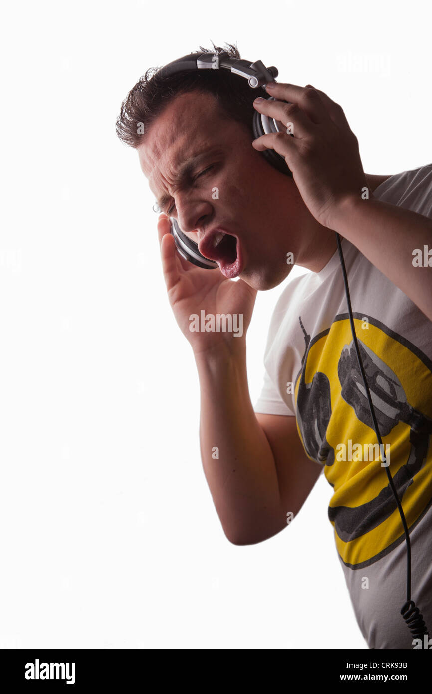 DJ singing with a fancy t shirt and headphones Stock Photo - Alamy