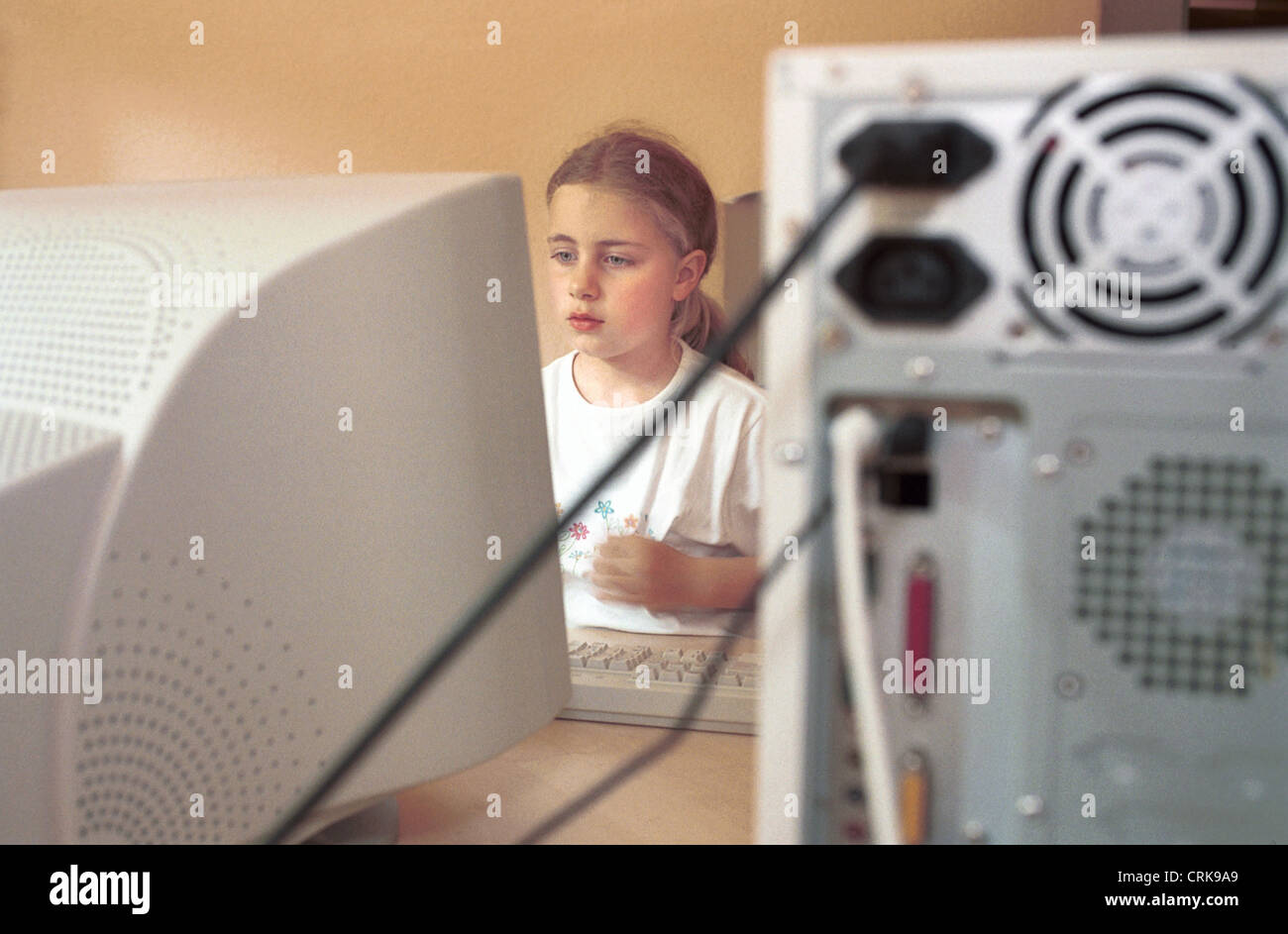 Girl on computer Stock Photo - Alamy
