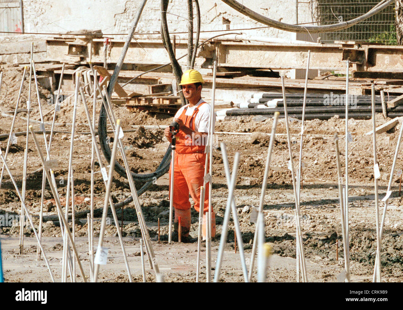 Construction workers at a construction site during drilling Stock Photo ...
