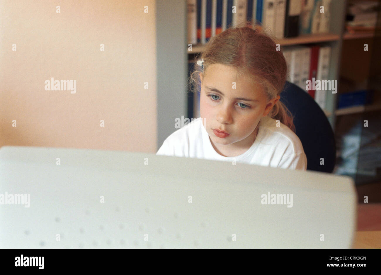 Girl on computer Stock Photo - Alamy
