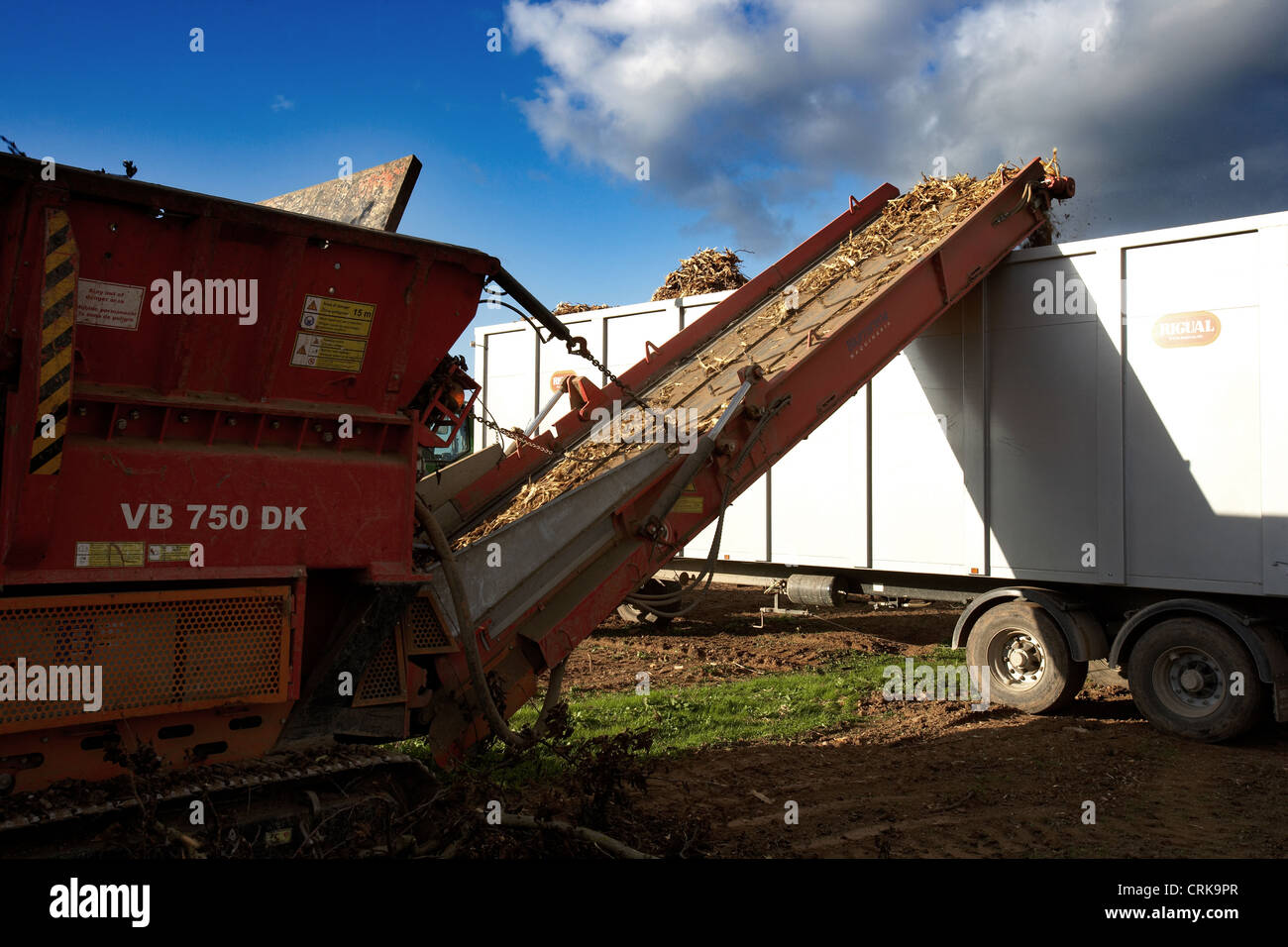 Machine of biomass grinding wood from trees Stock Photo - Alamy