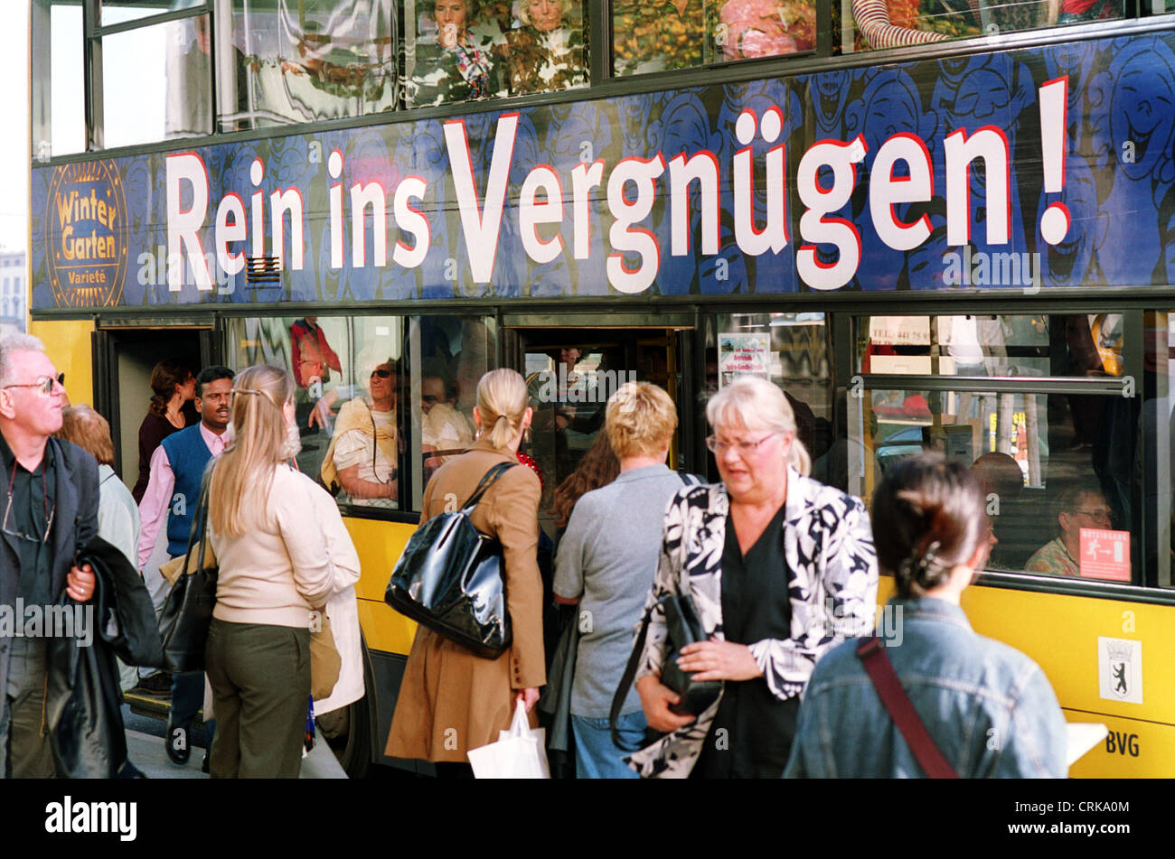 People jostle into a bus in Berlin Stock Photo - Alamy