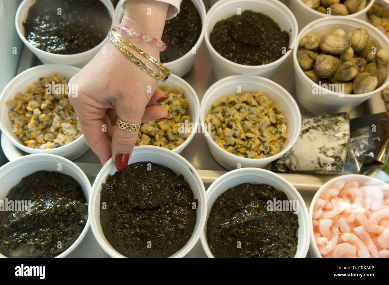 Cockles and Laverbread for sale in Swansea Market, UK Stock Photo - Alamy