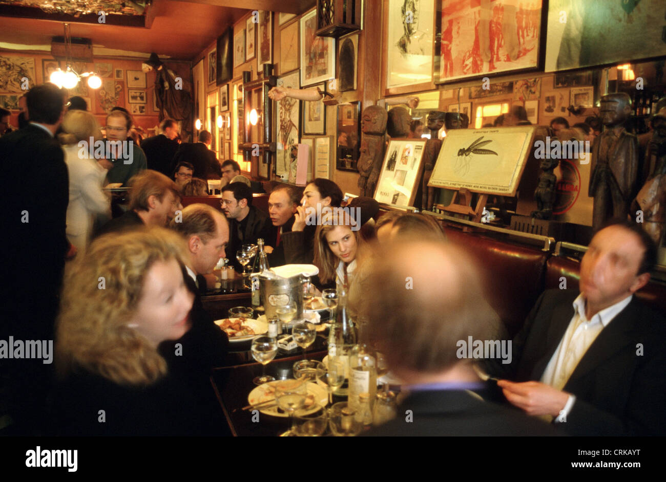 Guests talk at the Paris Bar Stock Photo - Alamy