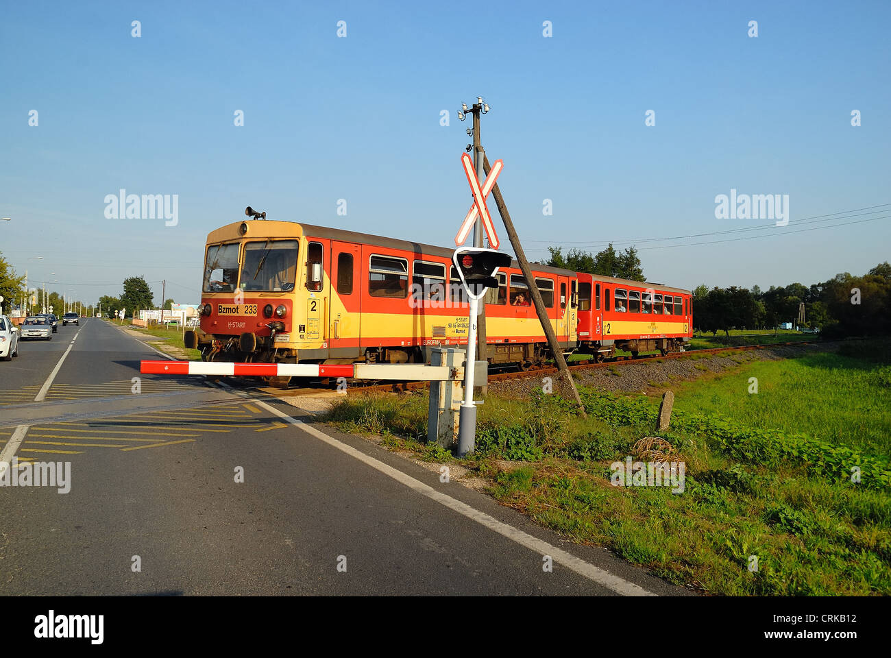 Train at a level crossing hi-res stock photography and images - Alamy