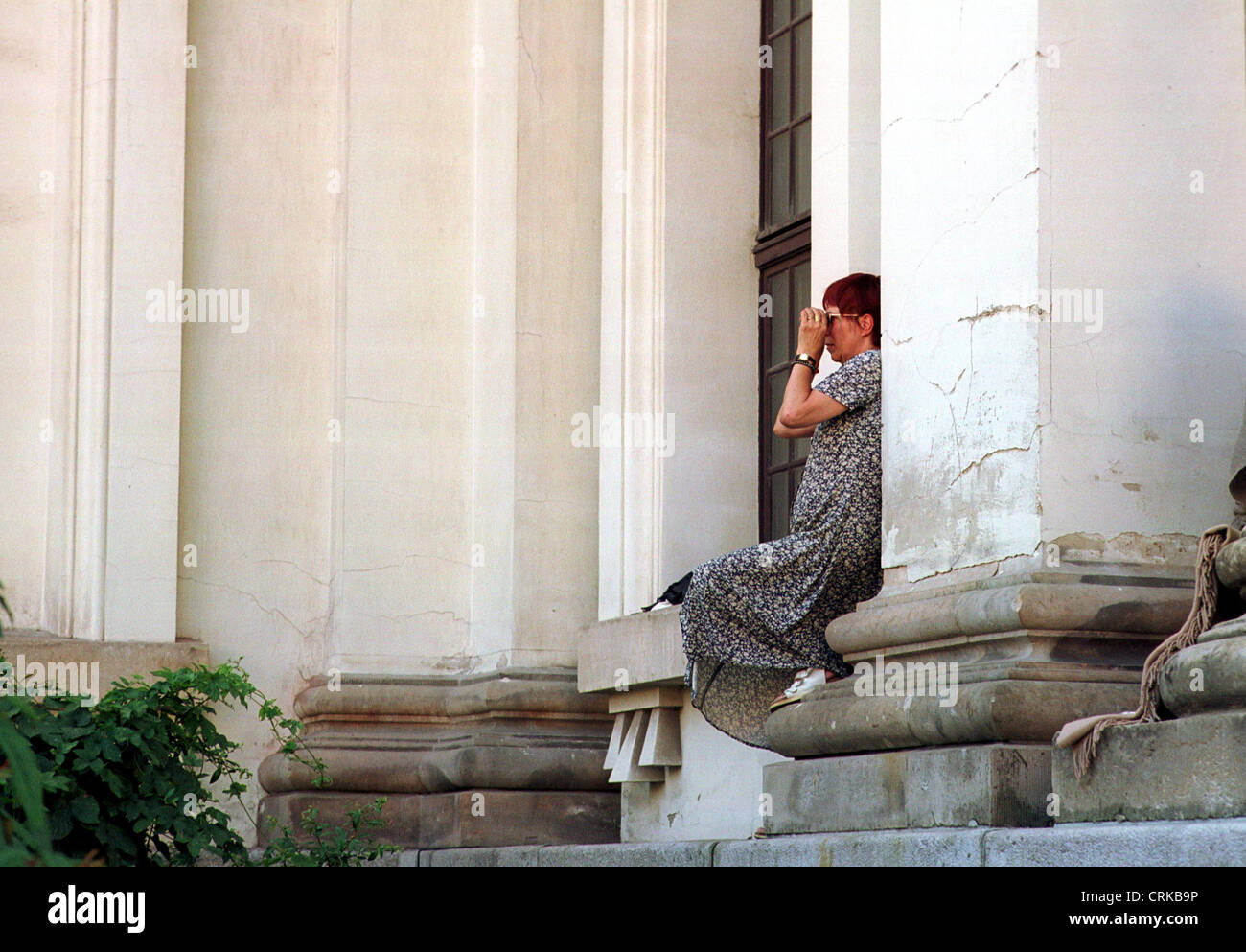 Berlin woman with binoculars pursued a concert Stock Photo - Alamy