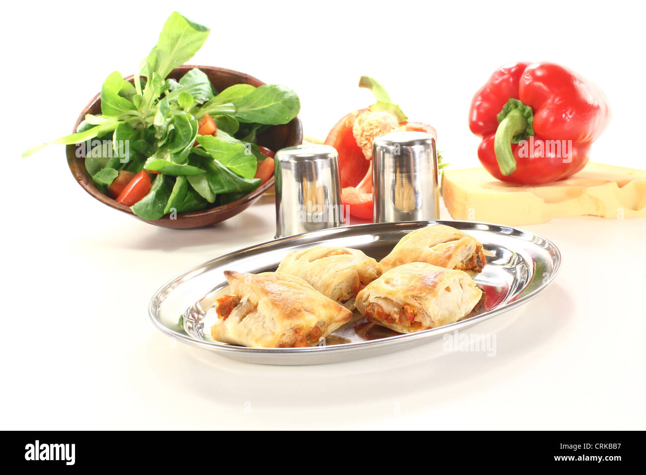 Puff pastry with cheese and bell peppers on a white background Stock ...