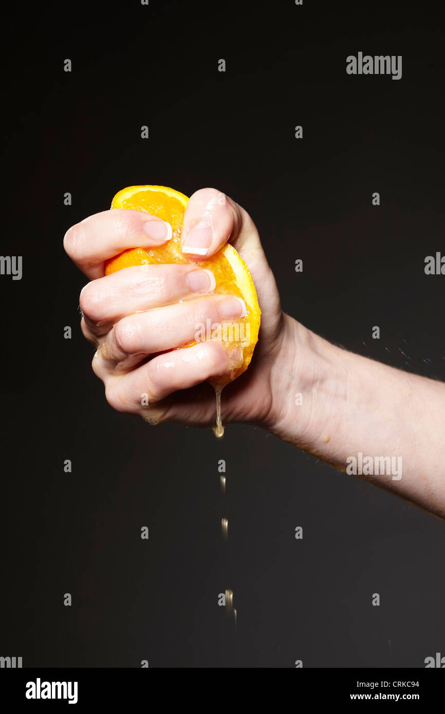 Hand squeezing food hi-res stock photography and images - Alamy