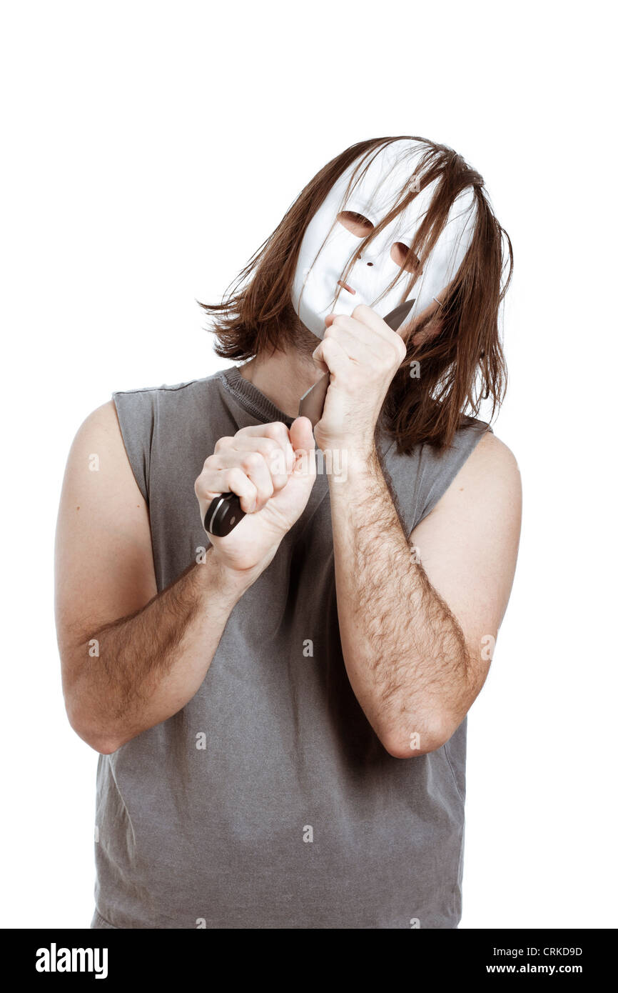 Scary bizarre masked man holding knife, isolated on white background ...