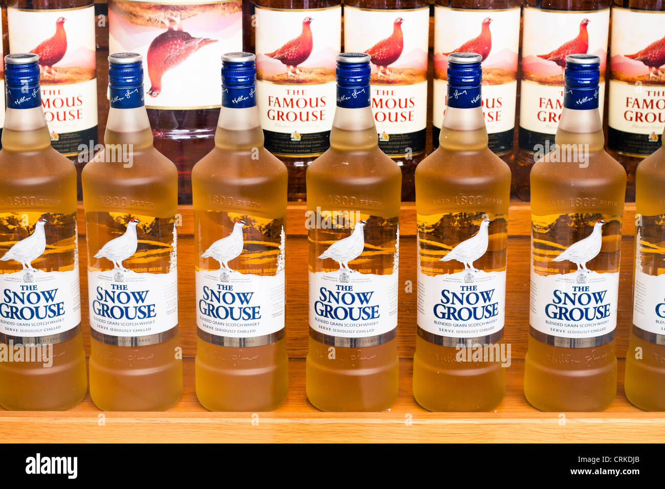 Detail of shop window with displayed bottles of alcohol. The Snow ...
