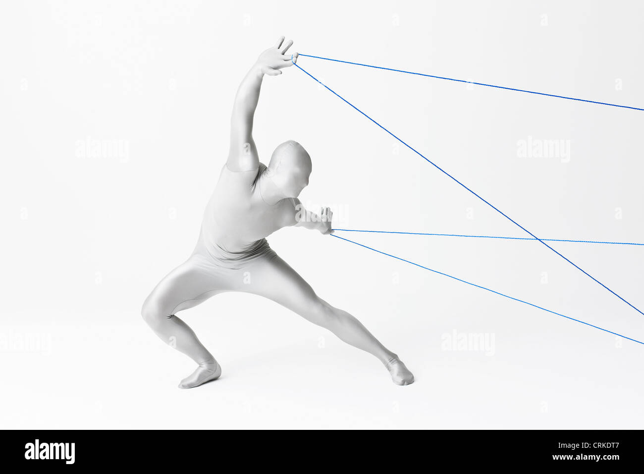 Man in bodysuit playing with string Stock Photo - Alamy