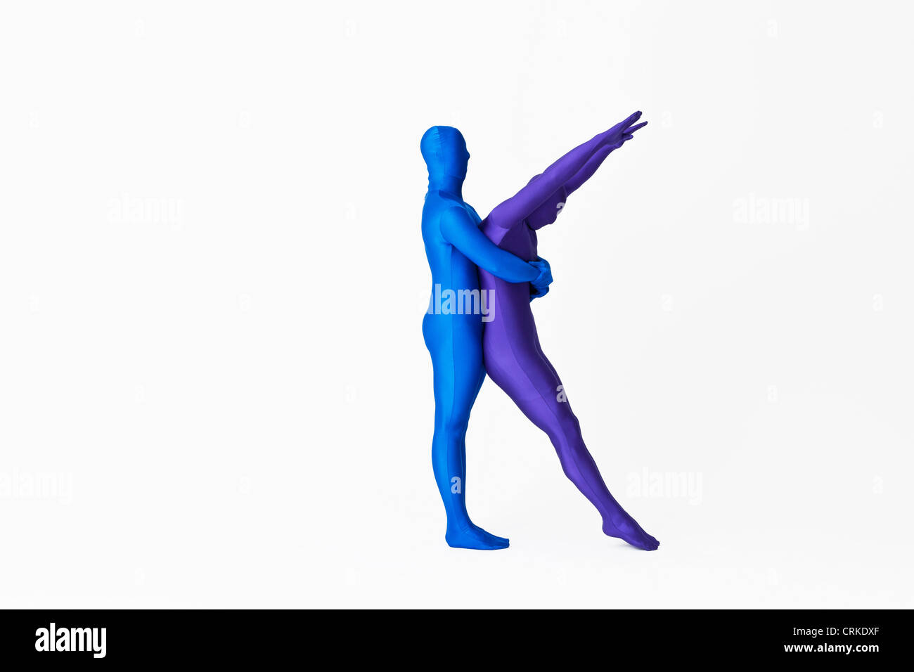 Men in bodysuits making the letter K Stock Photo - Alamy