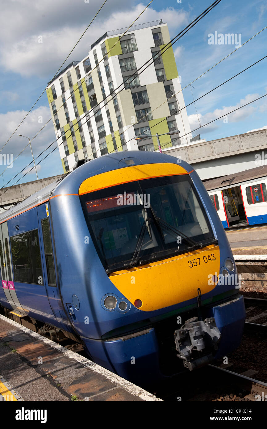 Train in C2C livery and a London Underground train waiting at a railway ...