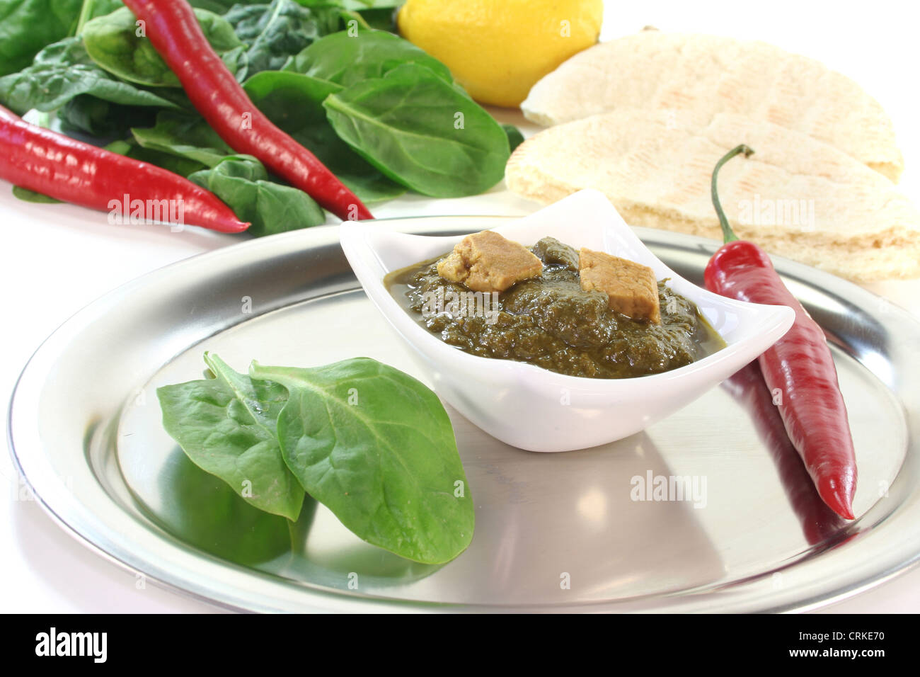 Indian Palak Paneer with mixed rice, ginger and Asian spices on light ...
