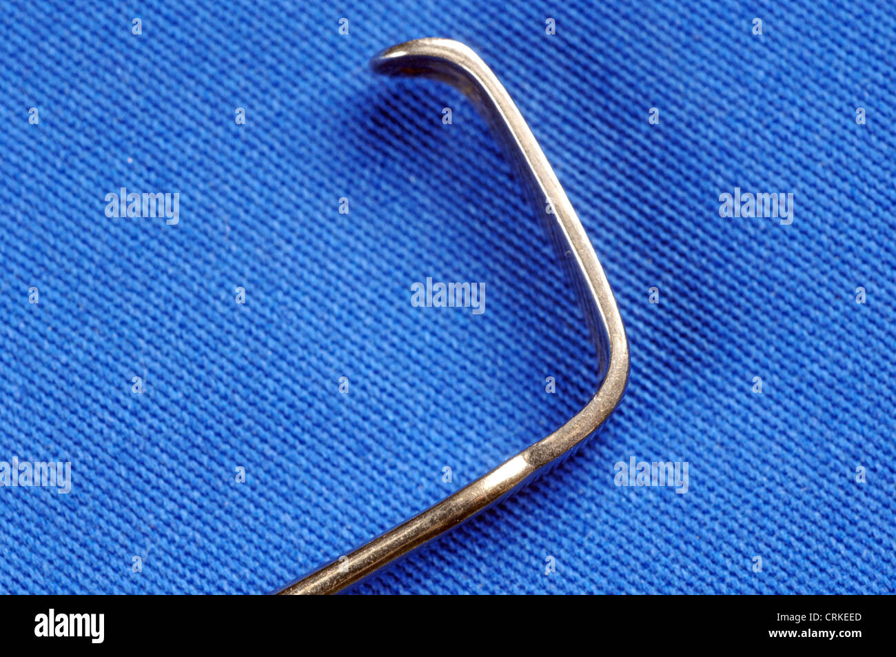 A medium Lagenbeck retractor; a handheld retractor used to maintain ...