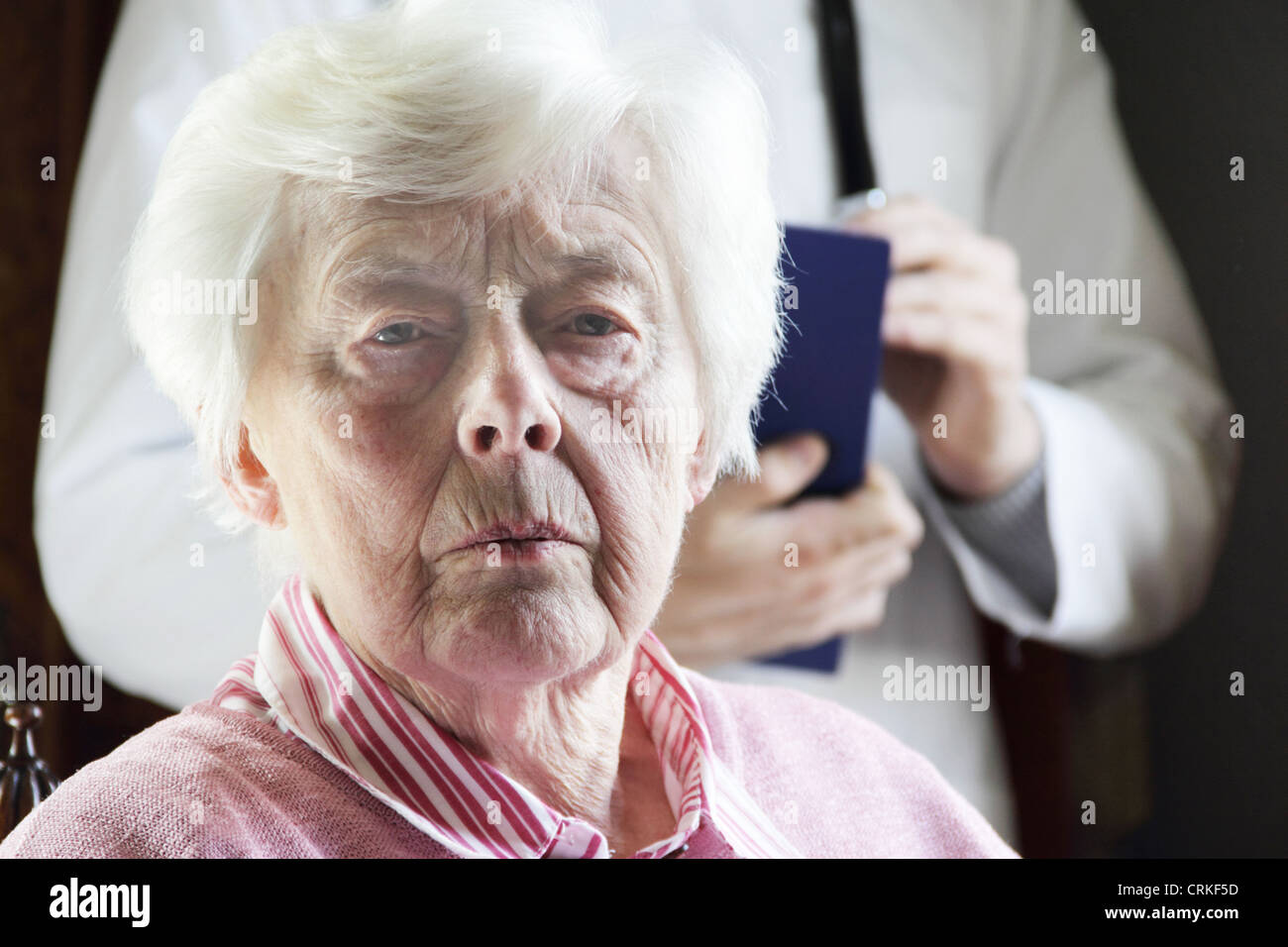 Close up of older womans frowning face Stock Photo - Alamy