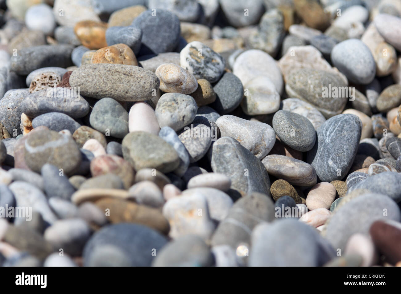 Abstract background with round pebble stones Stock Photo - Alamy