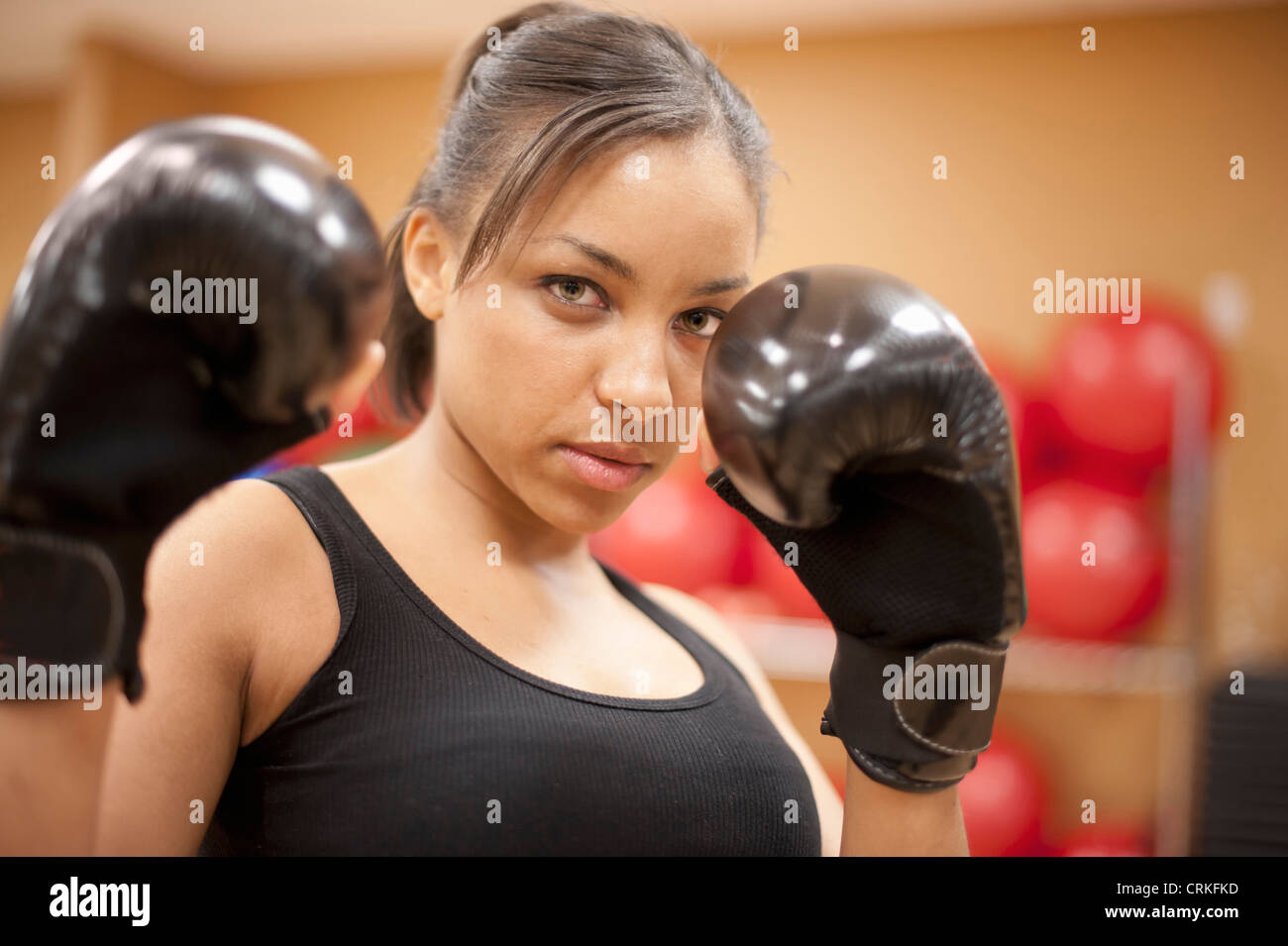 Woman kick boxing in gym Stock Photo - Alamy
