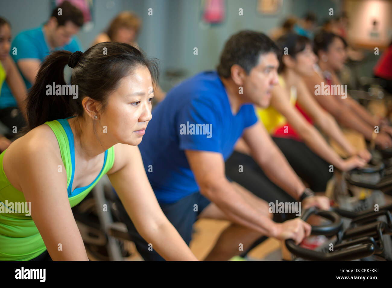 People using spin machines in gym Stock Photo - Alamy