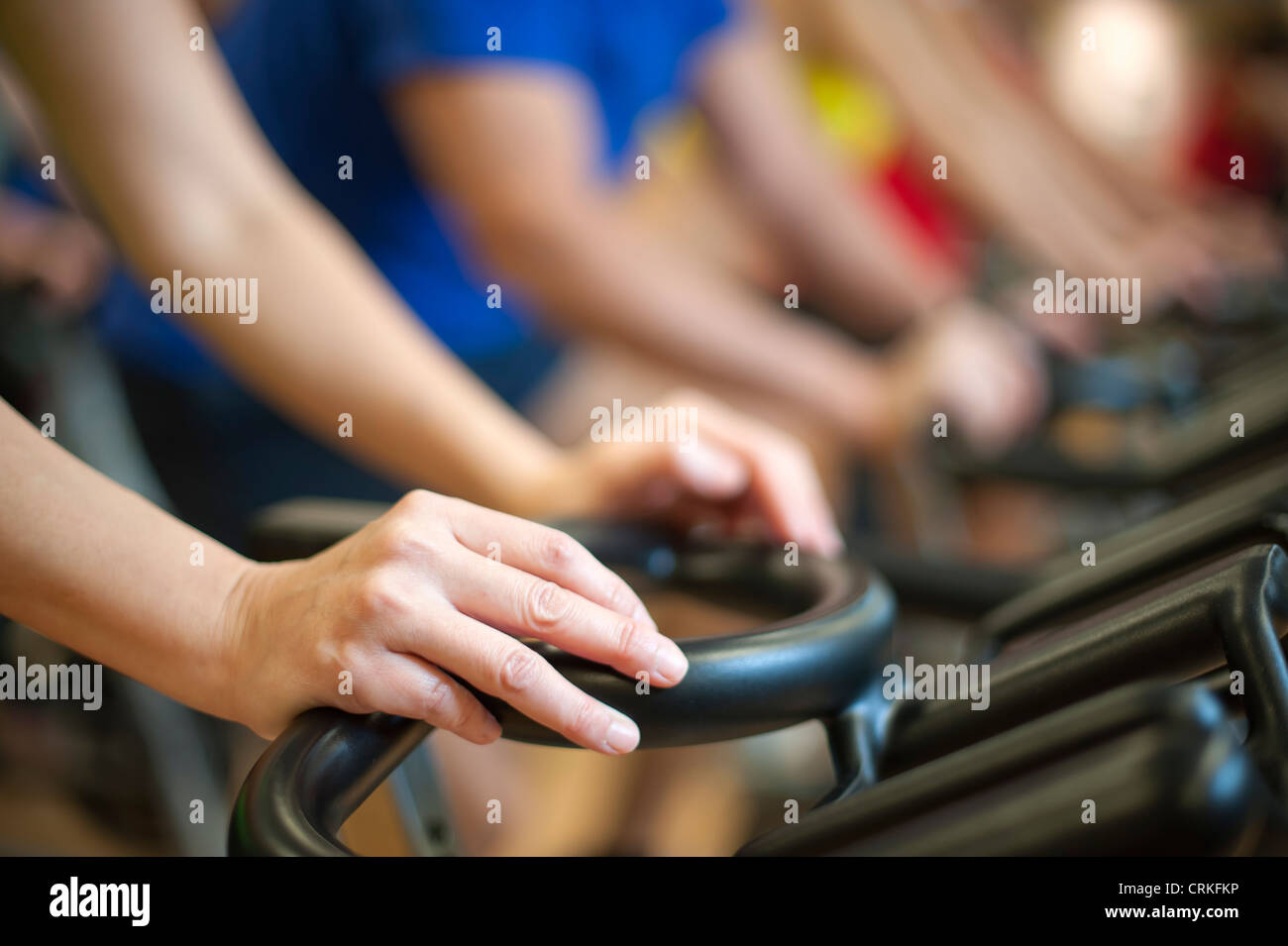 People using spin machines in gym Stock Photo - Alamy