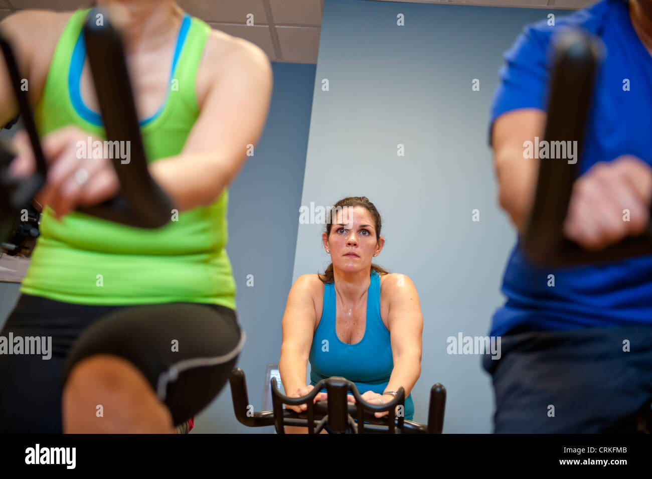 People using spin machines in gym Stock Photo - Alamy