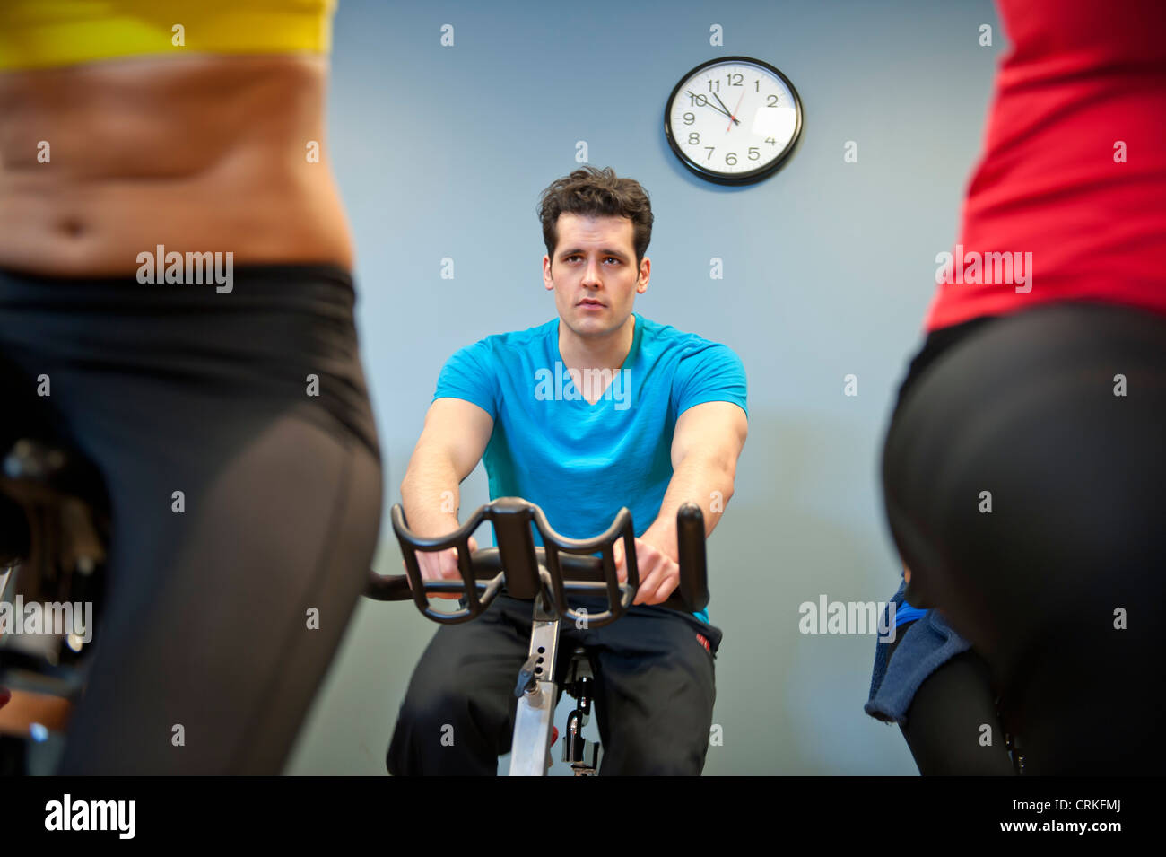 People using spin machines in gym Stock Photo - Alamy
