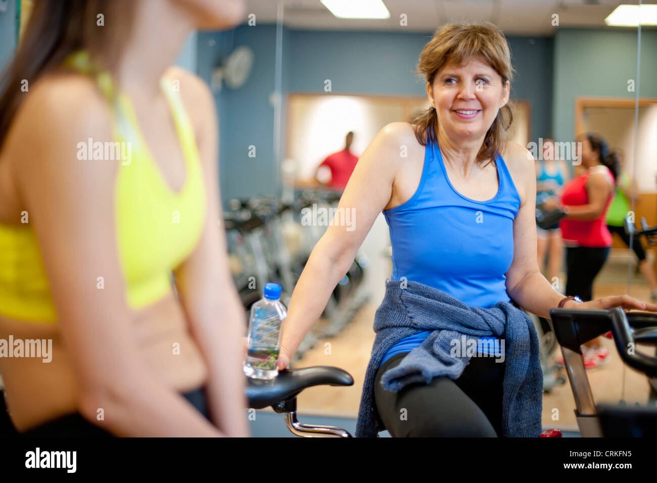 Gym, spin bike, happy woman hi-res stock photography and images - Alamy