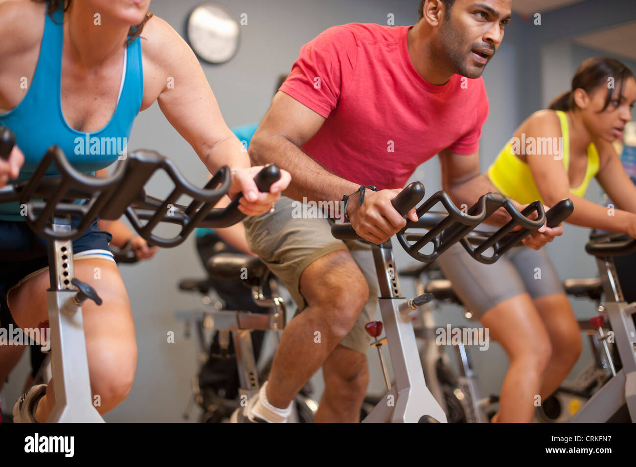 People using spin machines in gym Stock Photo - Alamy