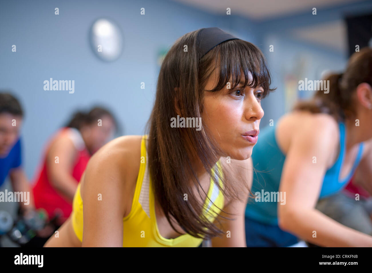 People using spin machines in gym Stock Photo - Alamy