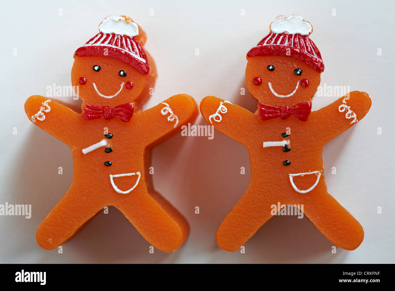 two gingerbread men candles isolated on white background Stock Photo ...