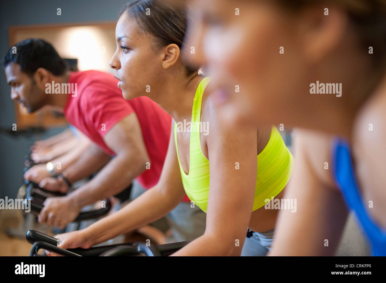 People using spin machines in gym Stock Photo - Alamy