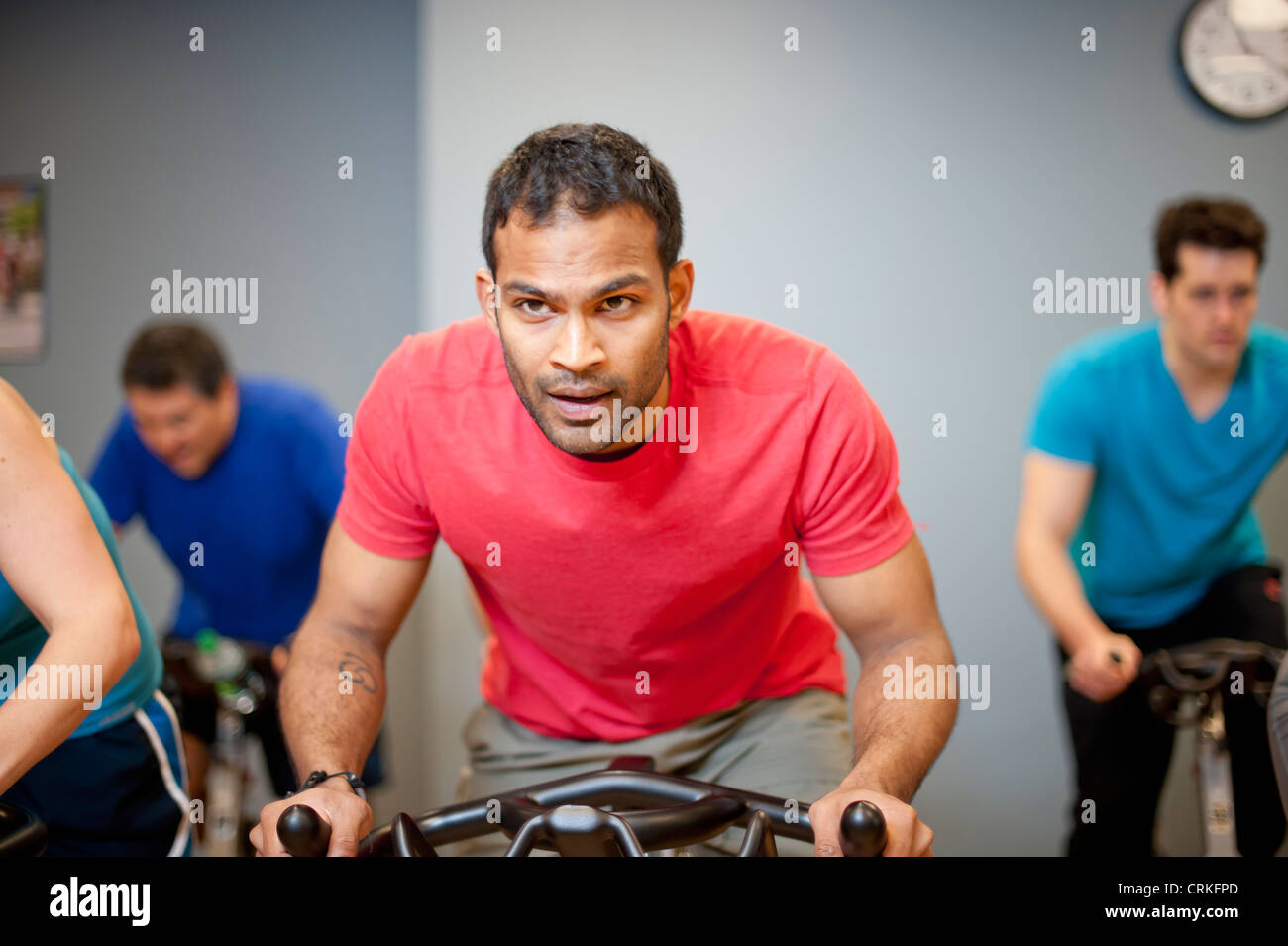 People using spin machines in gym Stock Photo - Alamy