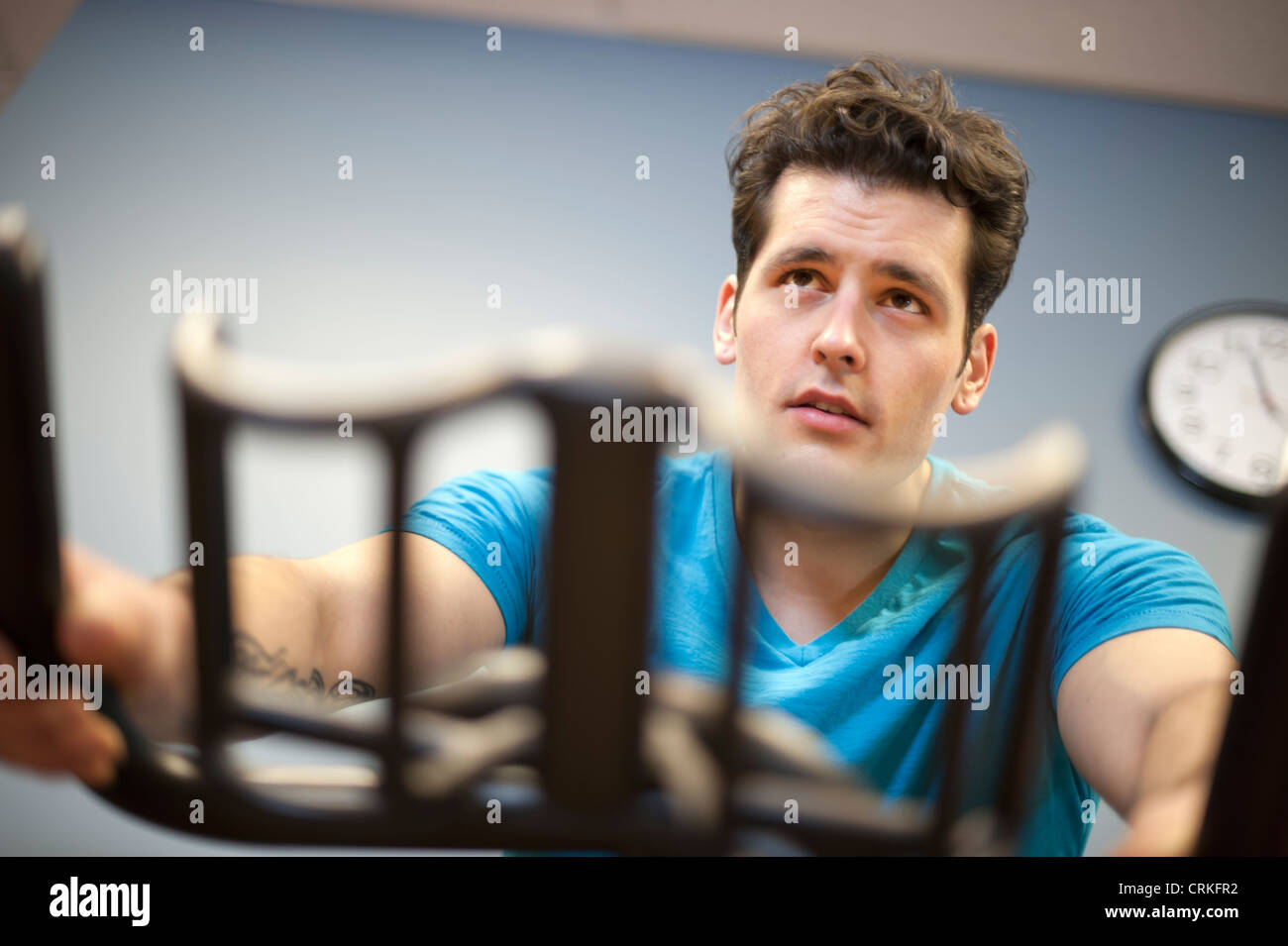 Man using spin machine in gym Stock Photo - Alamy