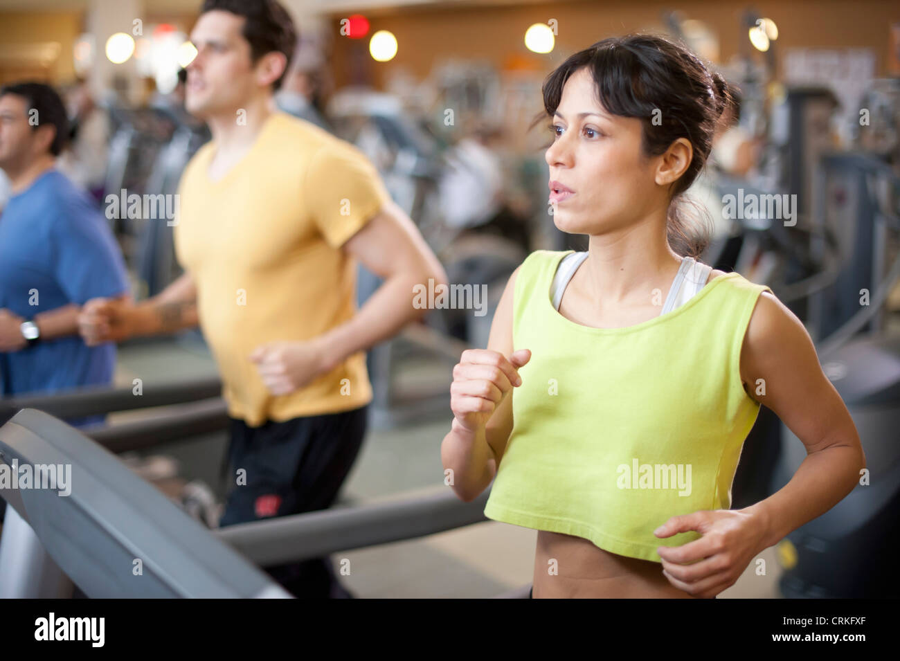 People using treadmills in gym Stock Photo - Alamy
