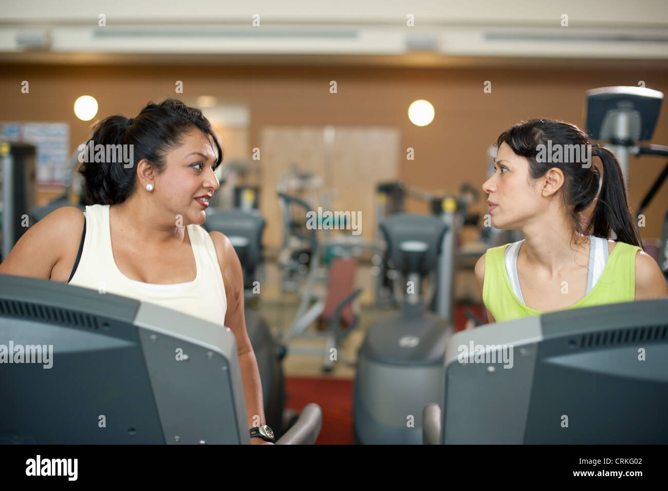 Women using treadmills in gym Stock Photo - Alamy