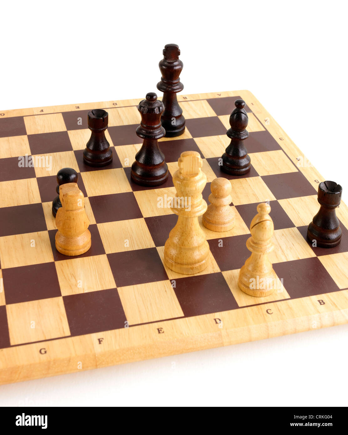 various pieces of a wooden chess set demonstrating check mate on the ...