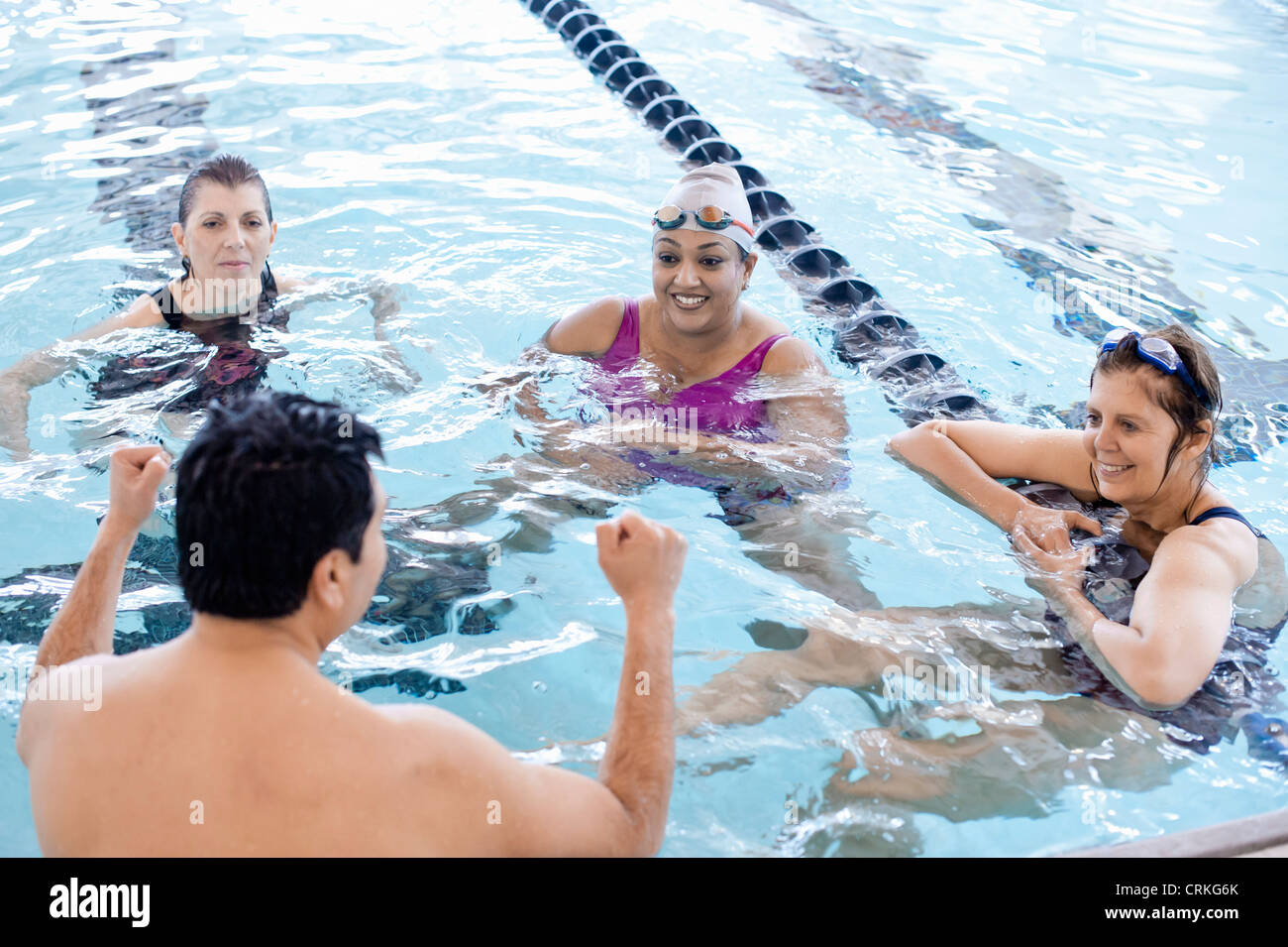 People relaxing in swimming pool Stock Photo - Alamy