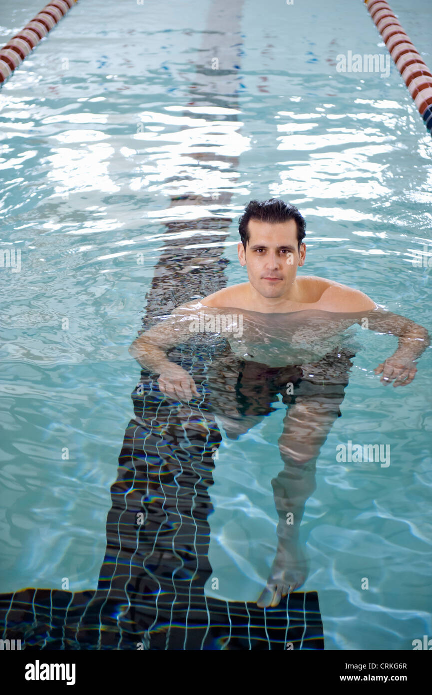 Man treading water in swimming pool Stock Photo - Alamy